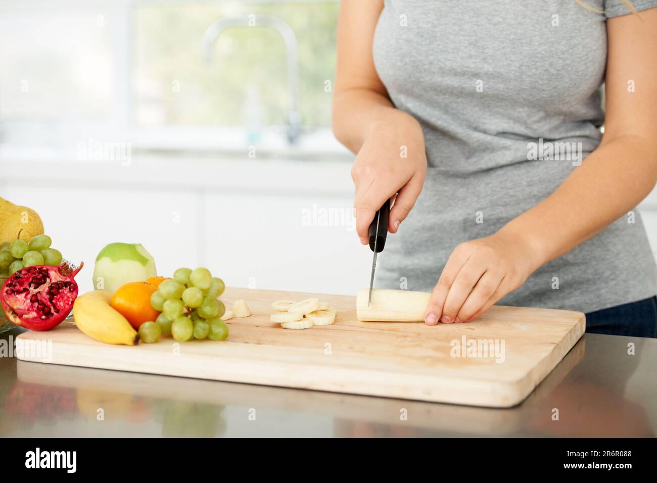 Woman hands, cooking and fruit for health food and nutrition for weight ...