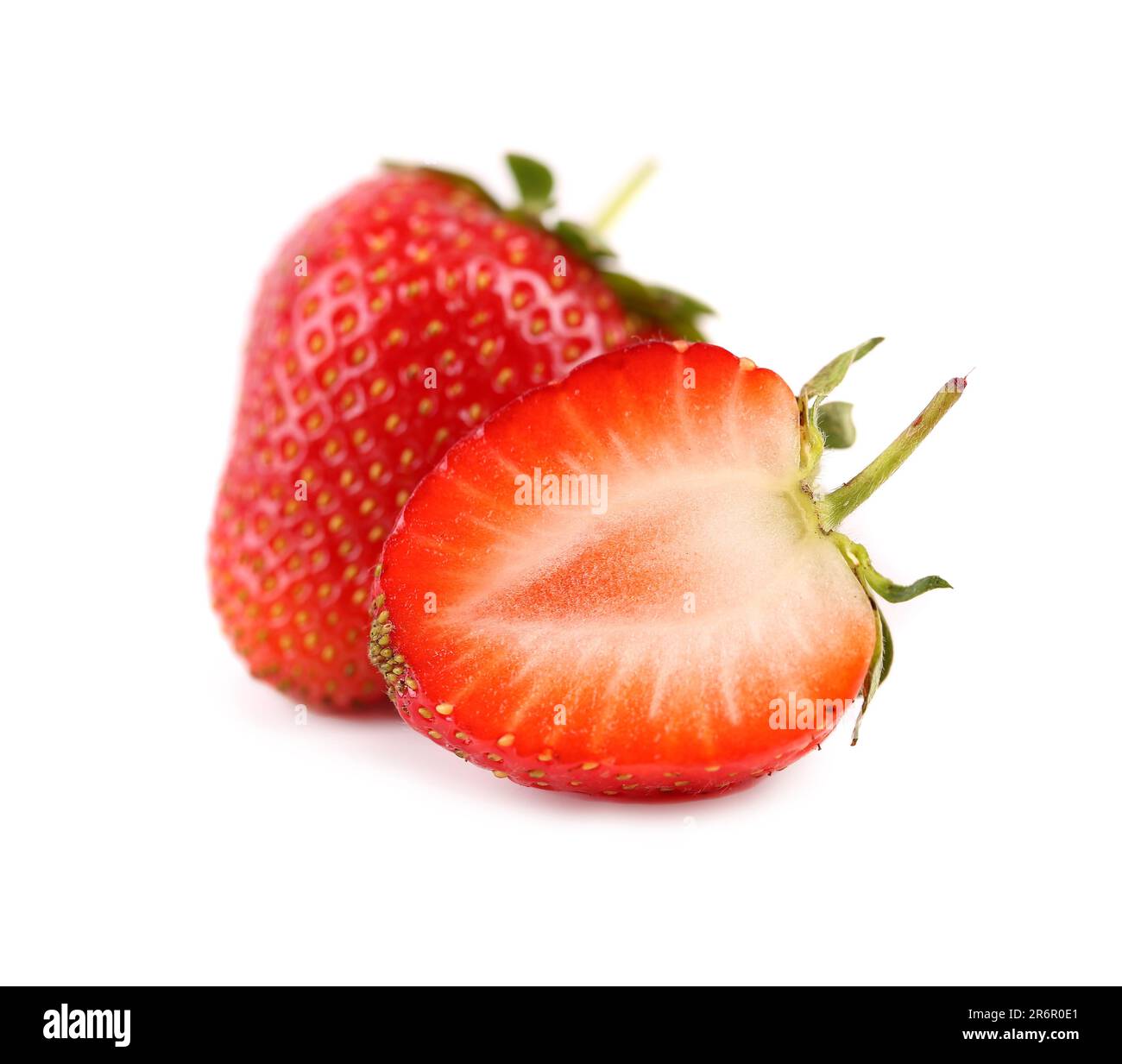 One and a half strawberry on the white background Stock Photo - Alamy