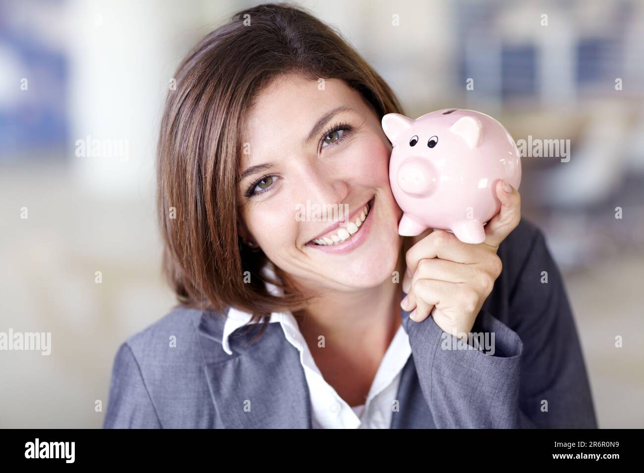 Happy, finance and portrait of a woman with a piggybank for savings ...