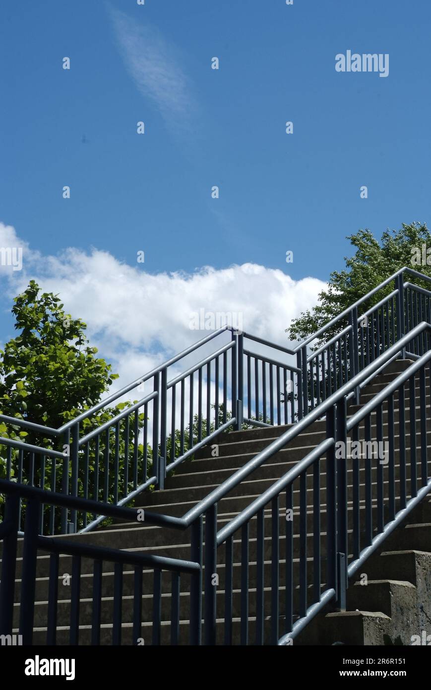 A set of concrete steps with metal railing in the park Stock Photo - Alamy