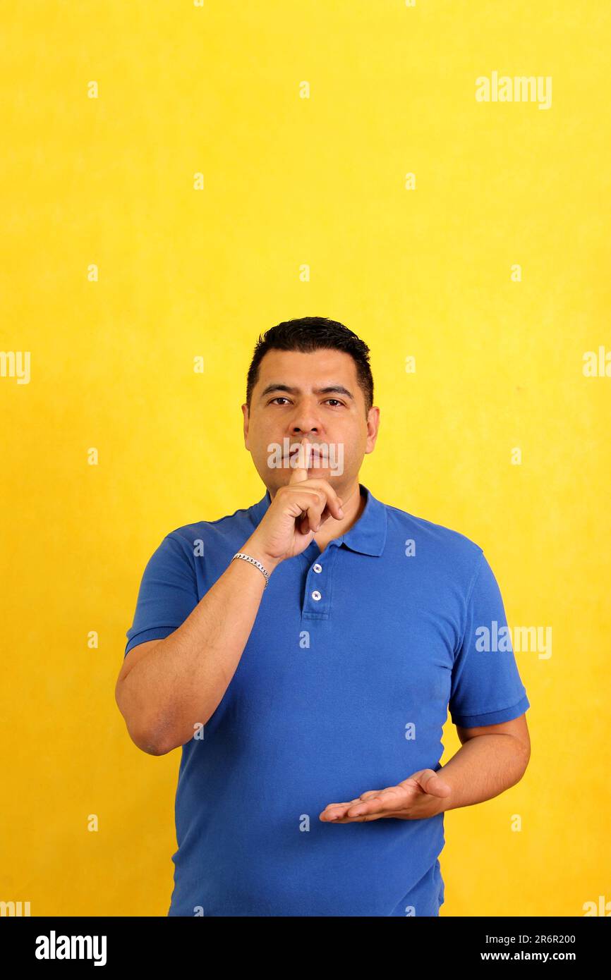 Dark-haired 40-year-old Latino man shows Mexican sign language used to ...