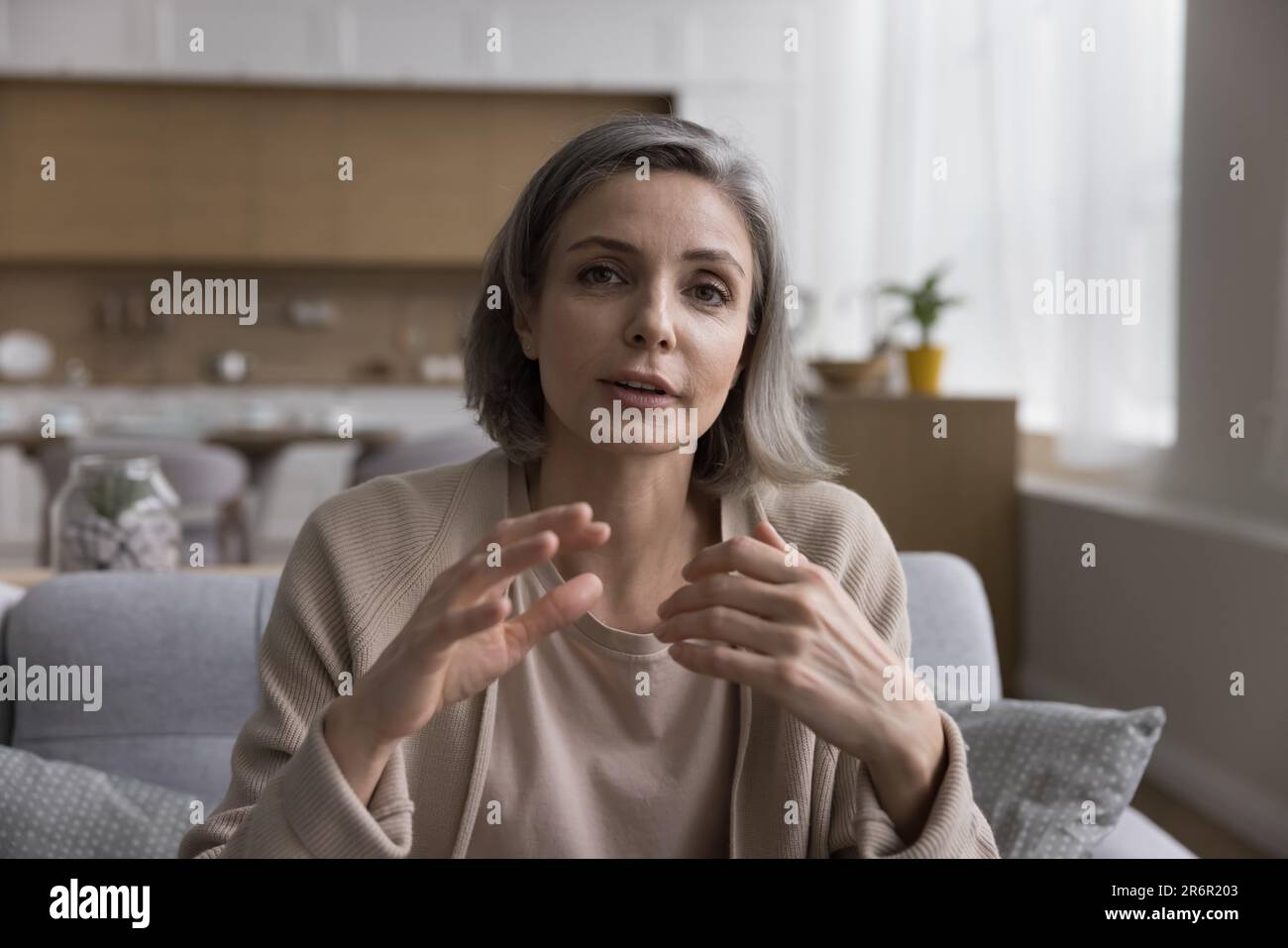 Positive grey haired woman home screen head shot portrait Stock Photo ...