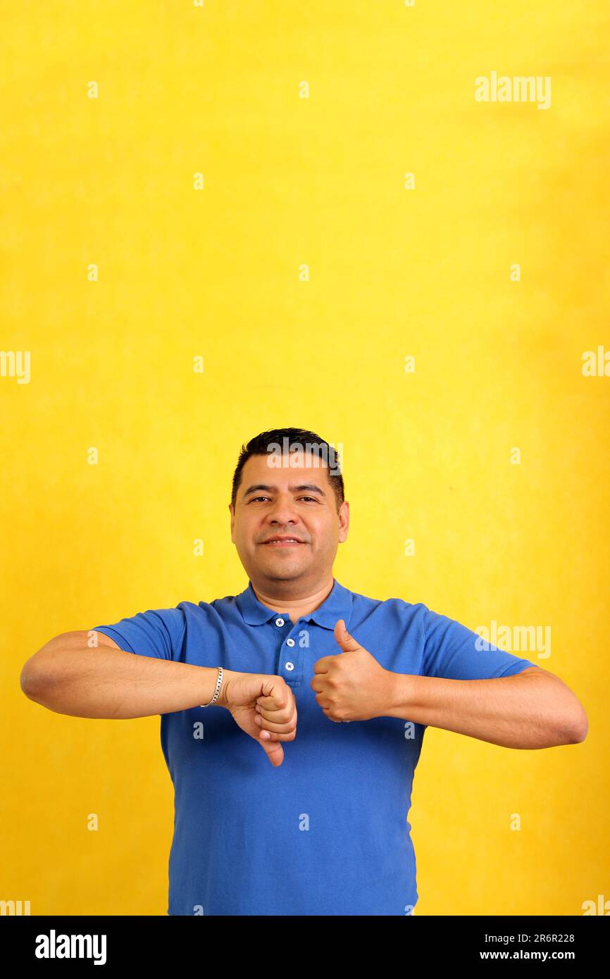 Dark-haired 40-year-old Latino man shows Mexican sign language used to ...
