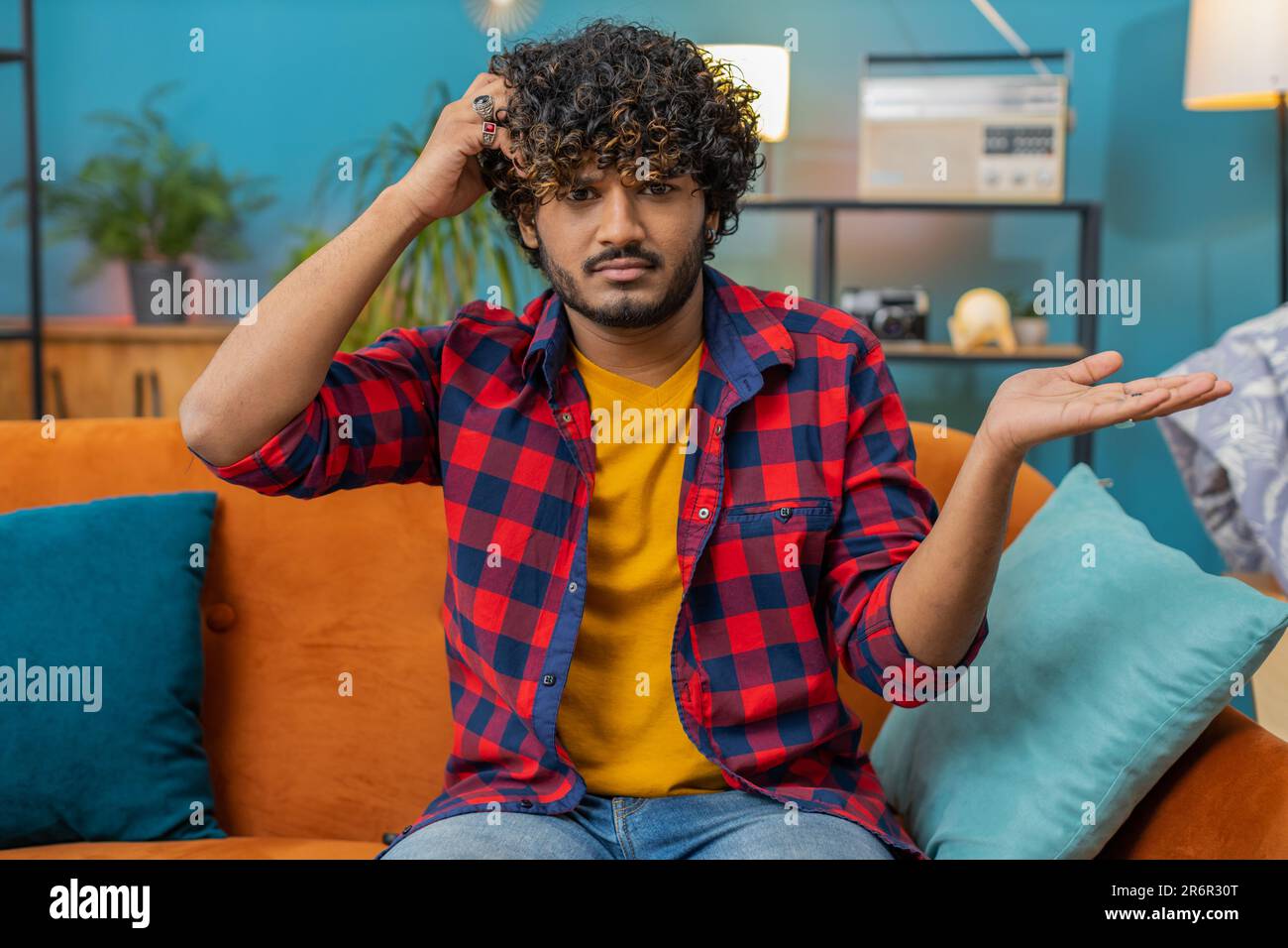 I dont know what to say. Confused indian handsome man feeling ...