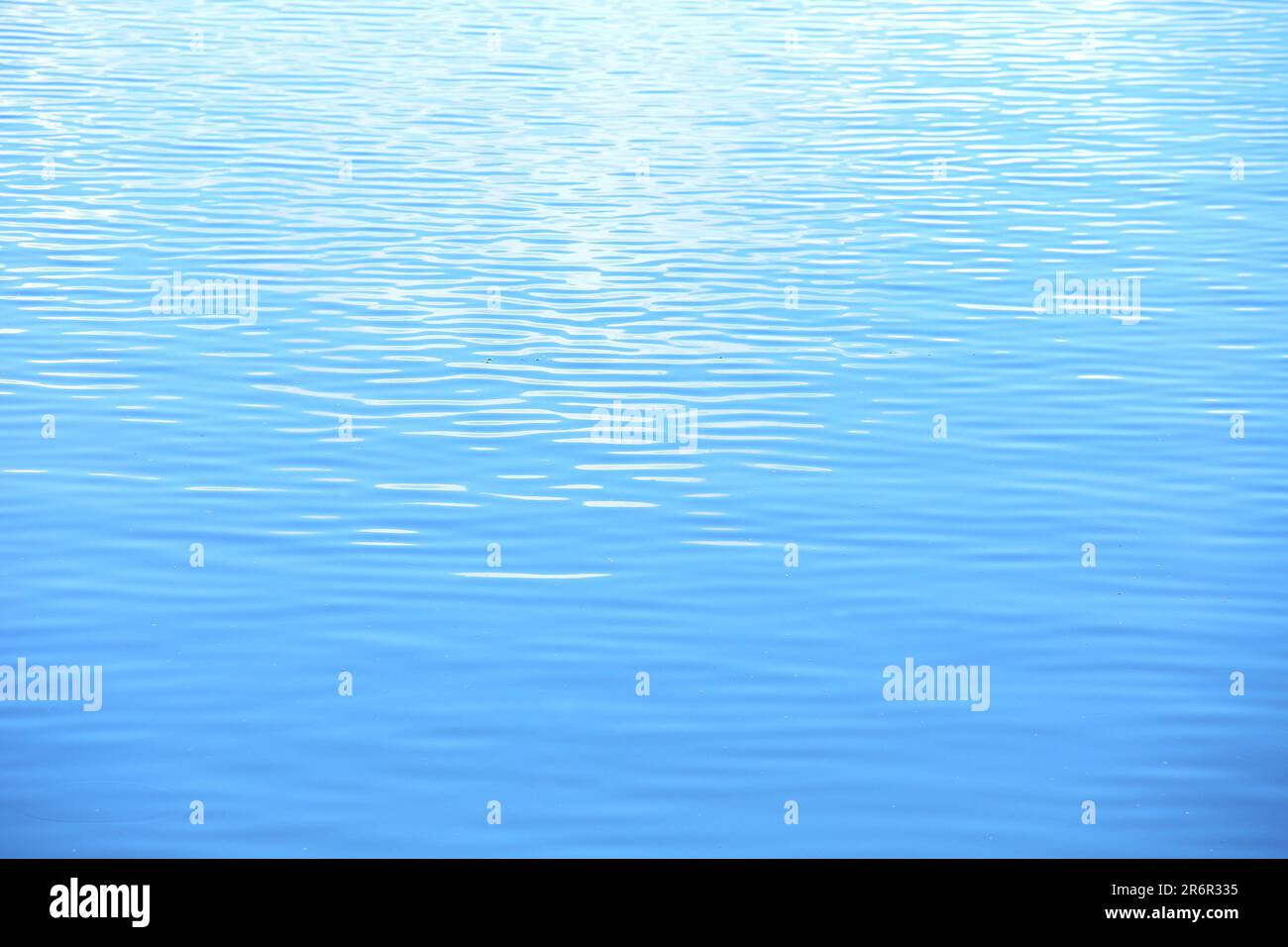 The water is a blue and the small ripples Stock Photo - Alamy