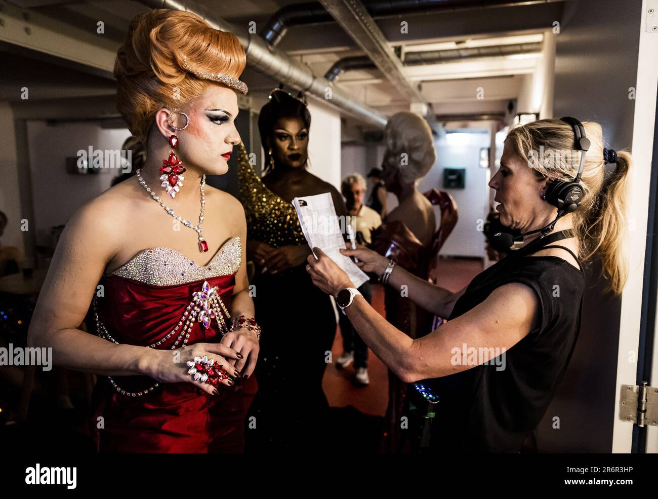 ROTTERDAM - Drag queens get a final instruction backstage before going ...