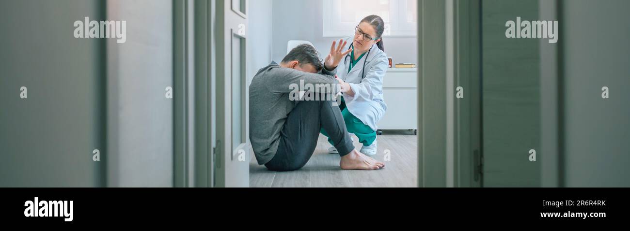 Female doctor trying to help male patient with mental disorder in ...