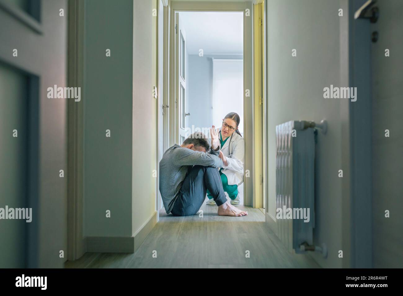 Female doctor trying to help male patient with mental disorder Stock ...