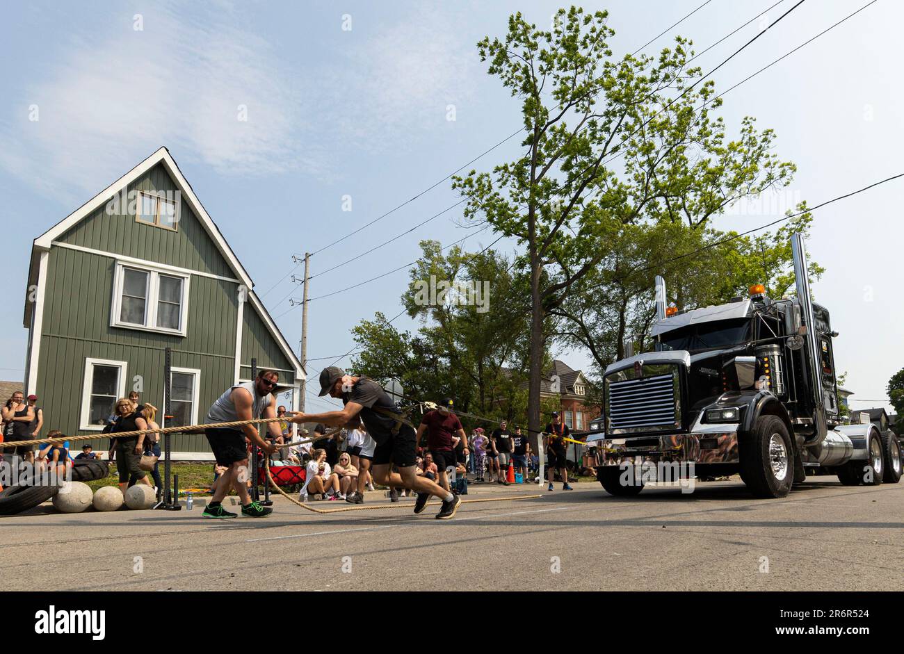 People Pulling Trucks
