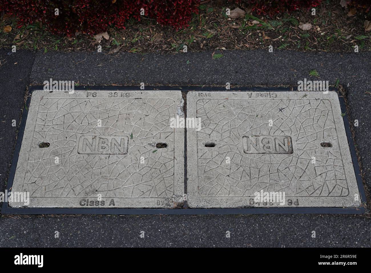 Concrete NBN, or National Broadband Network, cable pit covers embedded ...