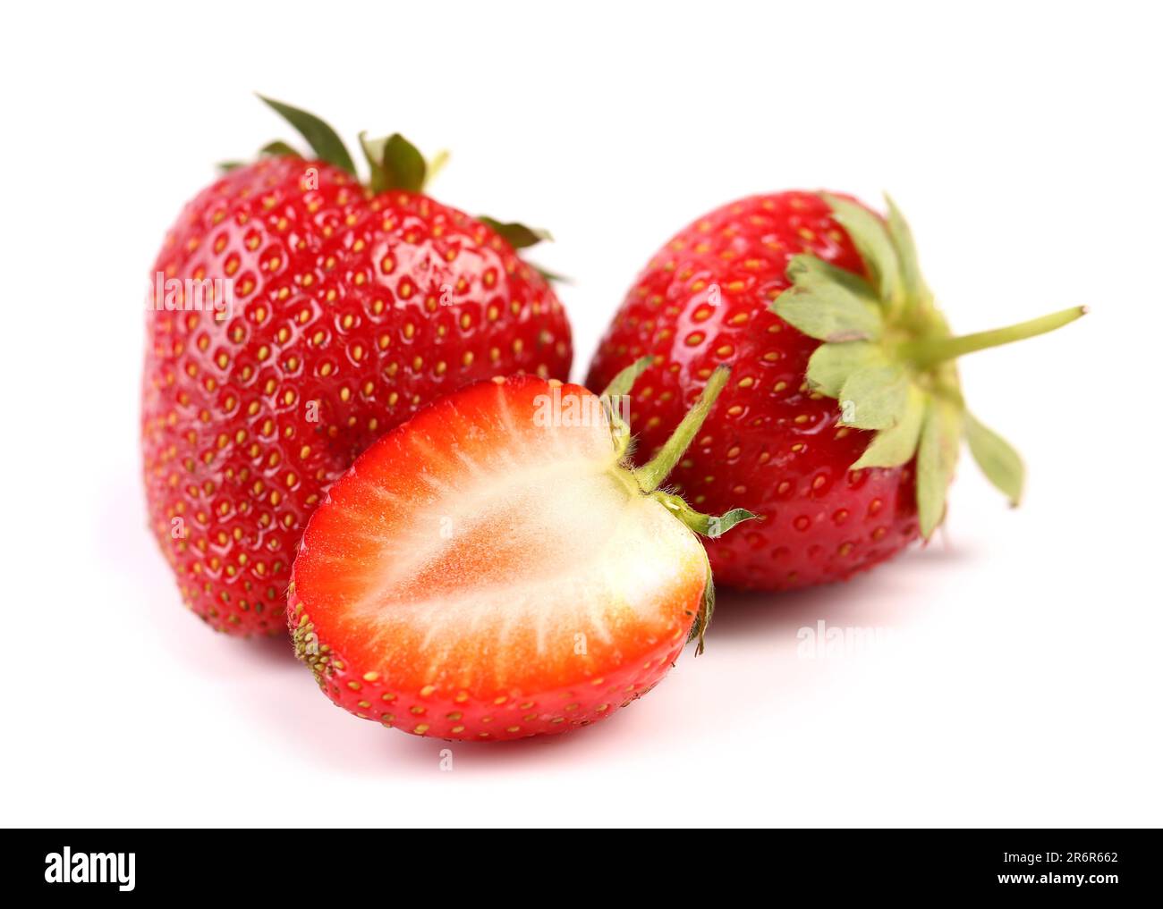 strawberries two and half isolated on white Stock Photo - Alamy