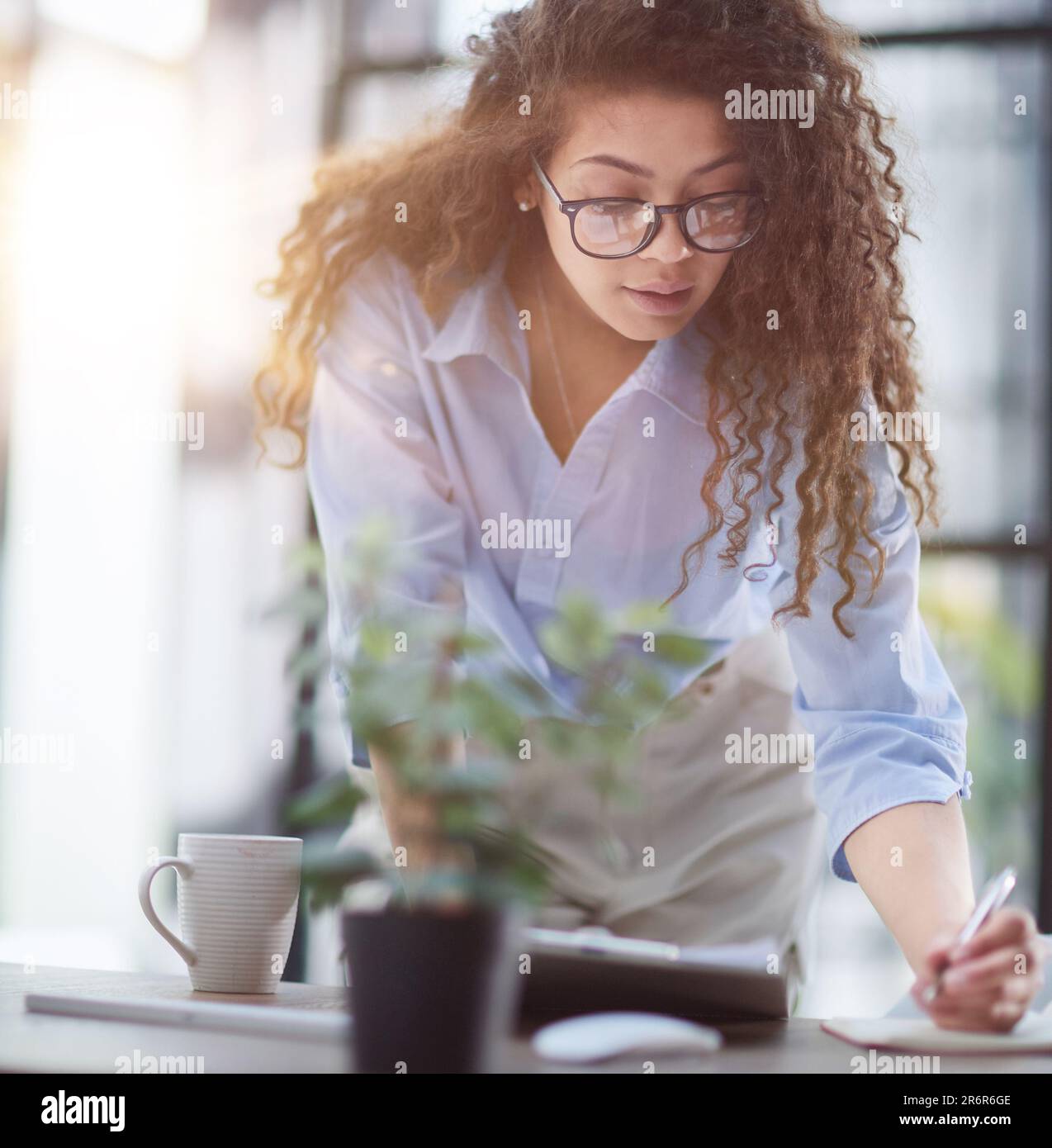 woman makes a report in the office. Woman writing notes for educational ...