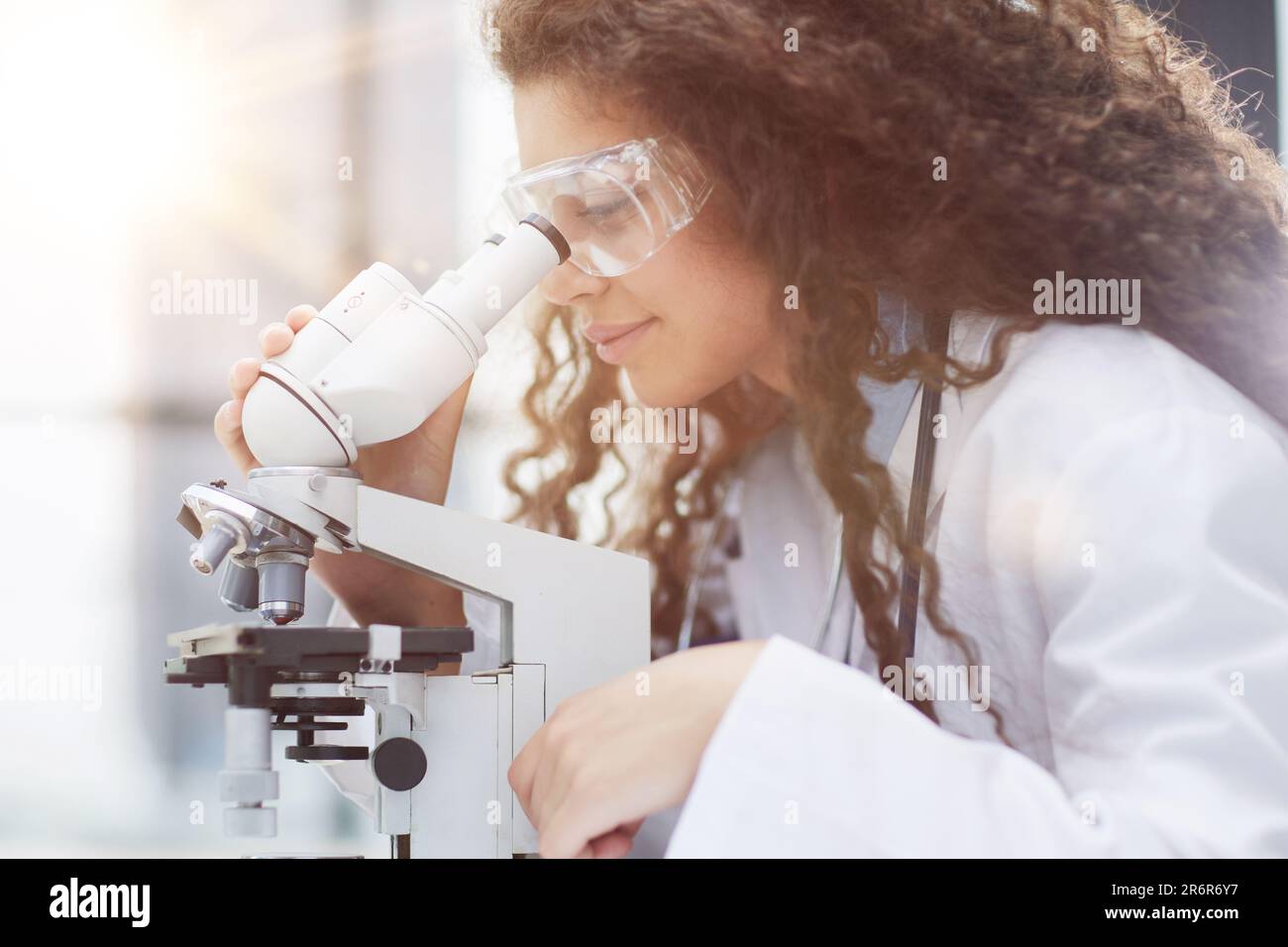 Young woman in biological laboratory. Attractive young female scientis ...