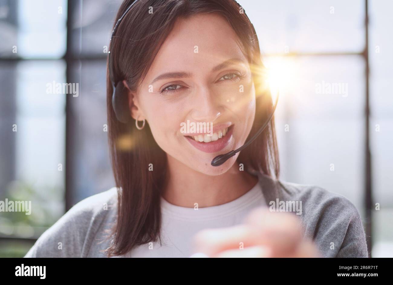 call center operator woman pointing with finger to the camera and to ...