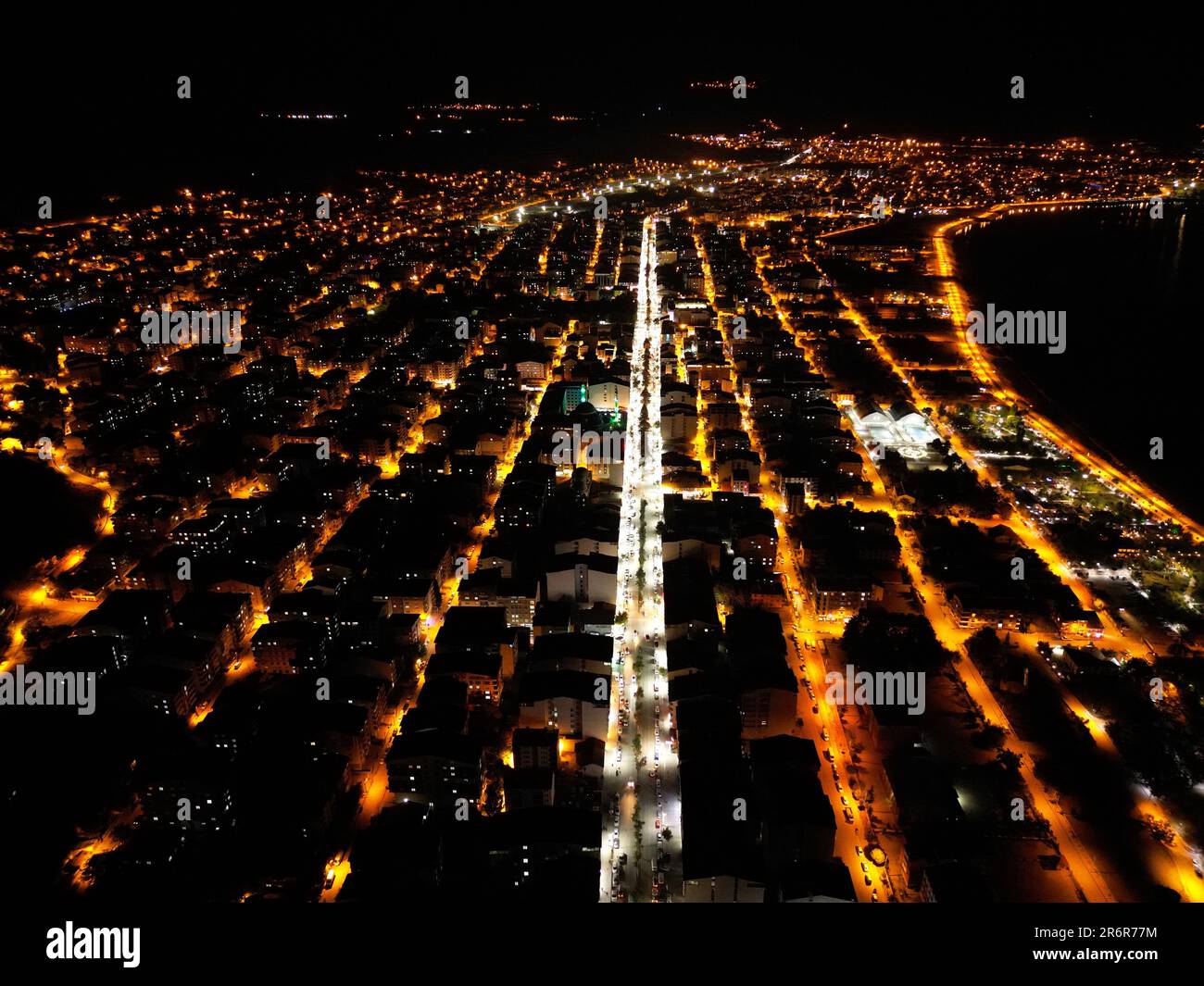 This aerial image captures the stunning night skyline of the city of ...