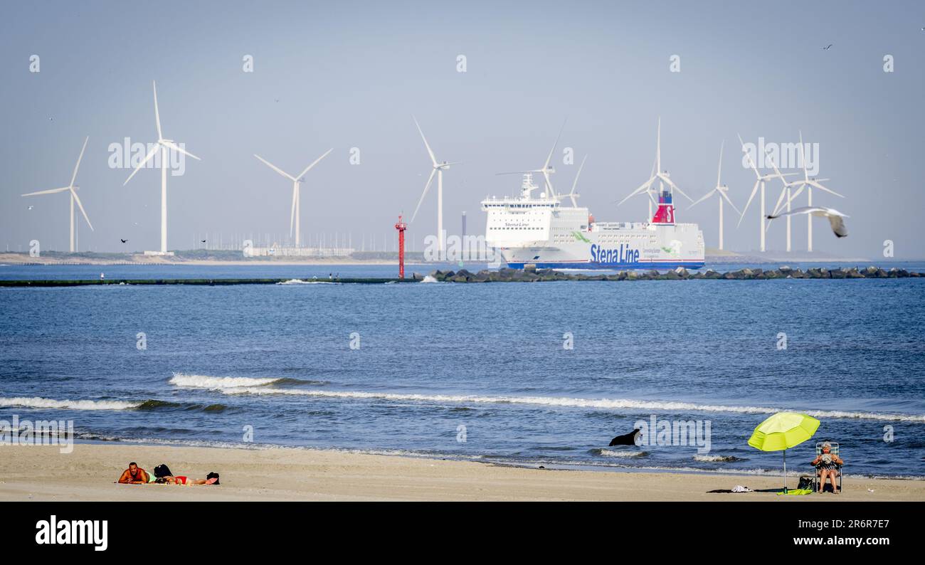 HOEK VAN HOLLAND - Bathers on the beach of Hoek van Holland. There are ...
