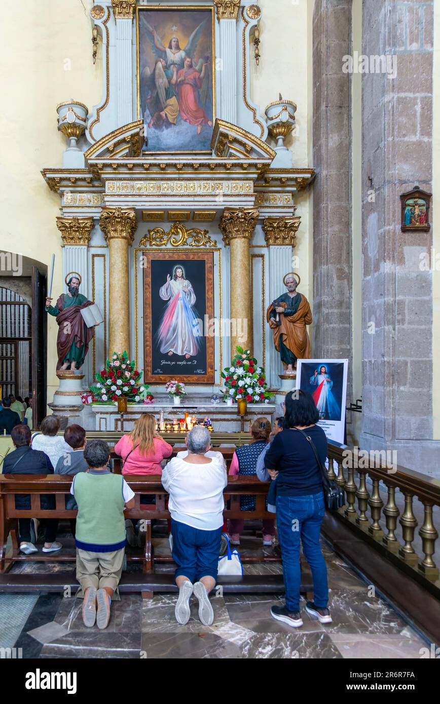 People praying at altar inside cathedral church, Catedral Metropolitana ...