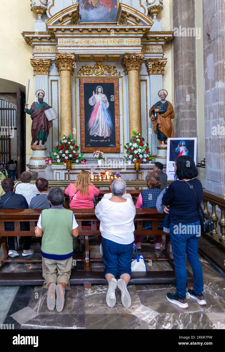 People praying at altar inside cathedral church, Catedral Metropolitana ...