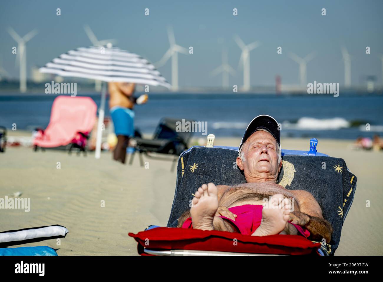 HOEK VAN HOLLAND - Bathers on the beach of Hoek van Holland. There are ...