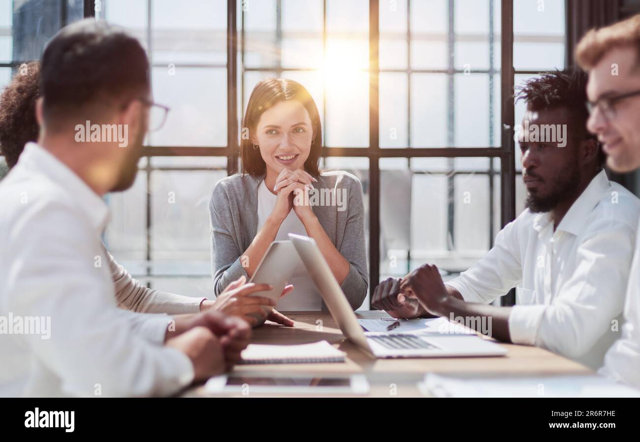 Employees working at computer together, discussing content Stock Photo ...
