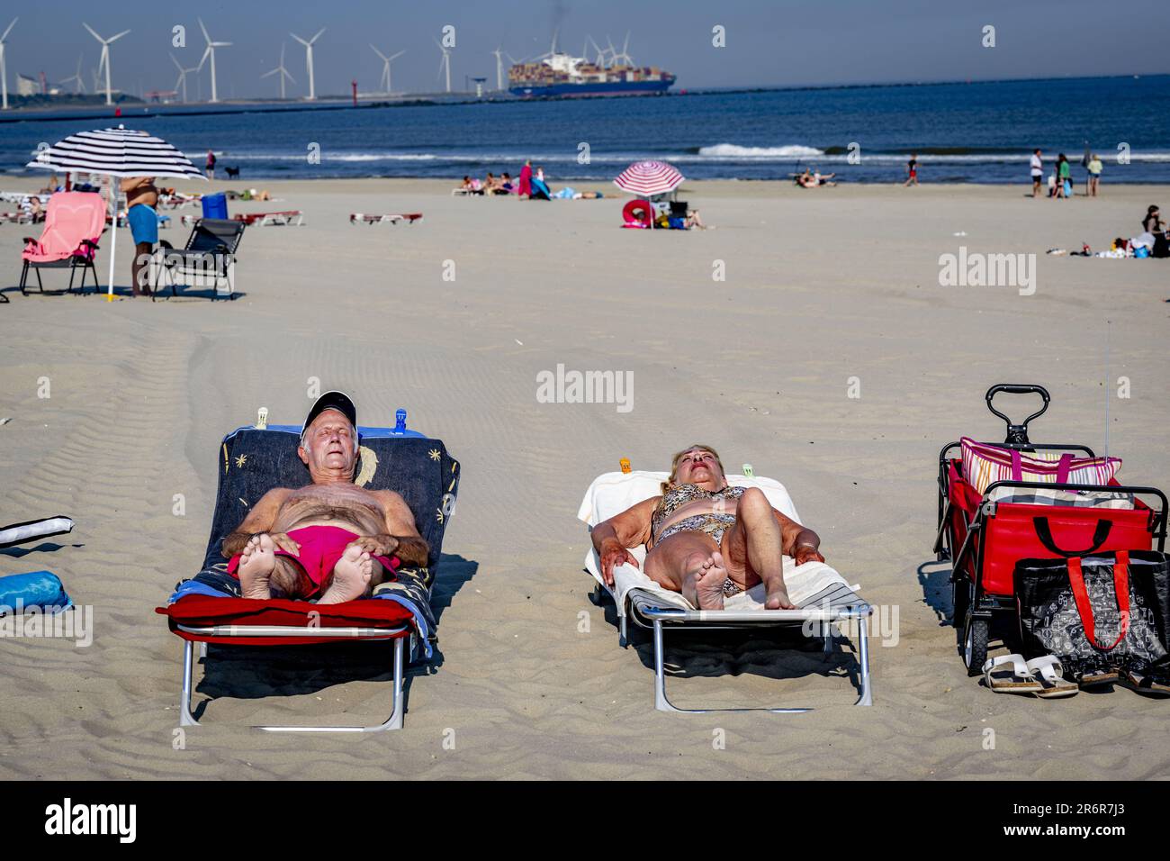 HOEK VAN HOLLAND - Bathers on the beach of Hoek van Holland. There are ...