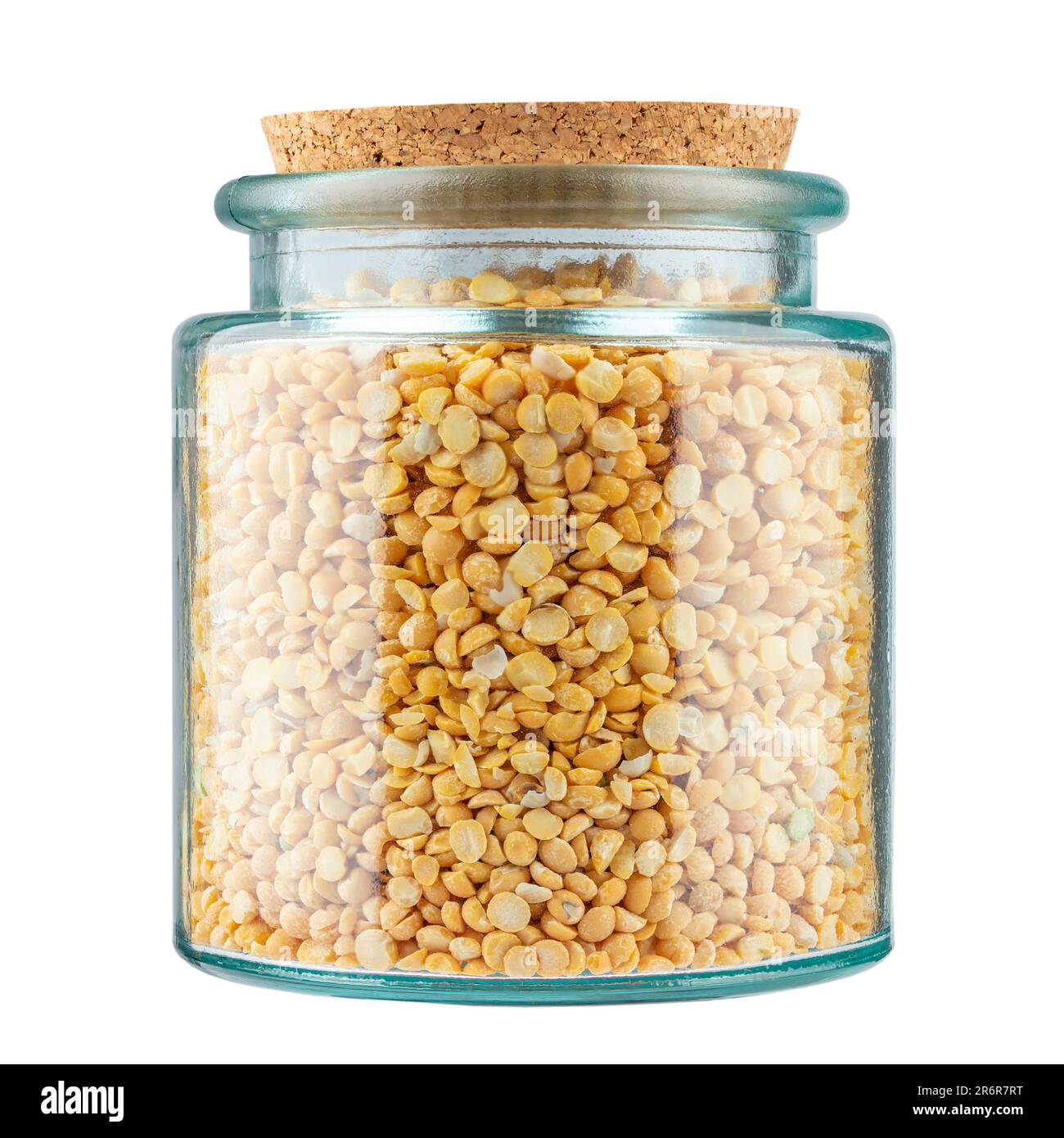 Dry yellow peas in a glass jar. Isolated on white background. File ...