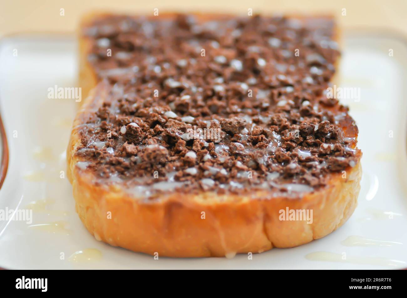 toast or bread with chocolate and condensed milk topping Stock Photo ...