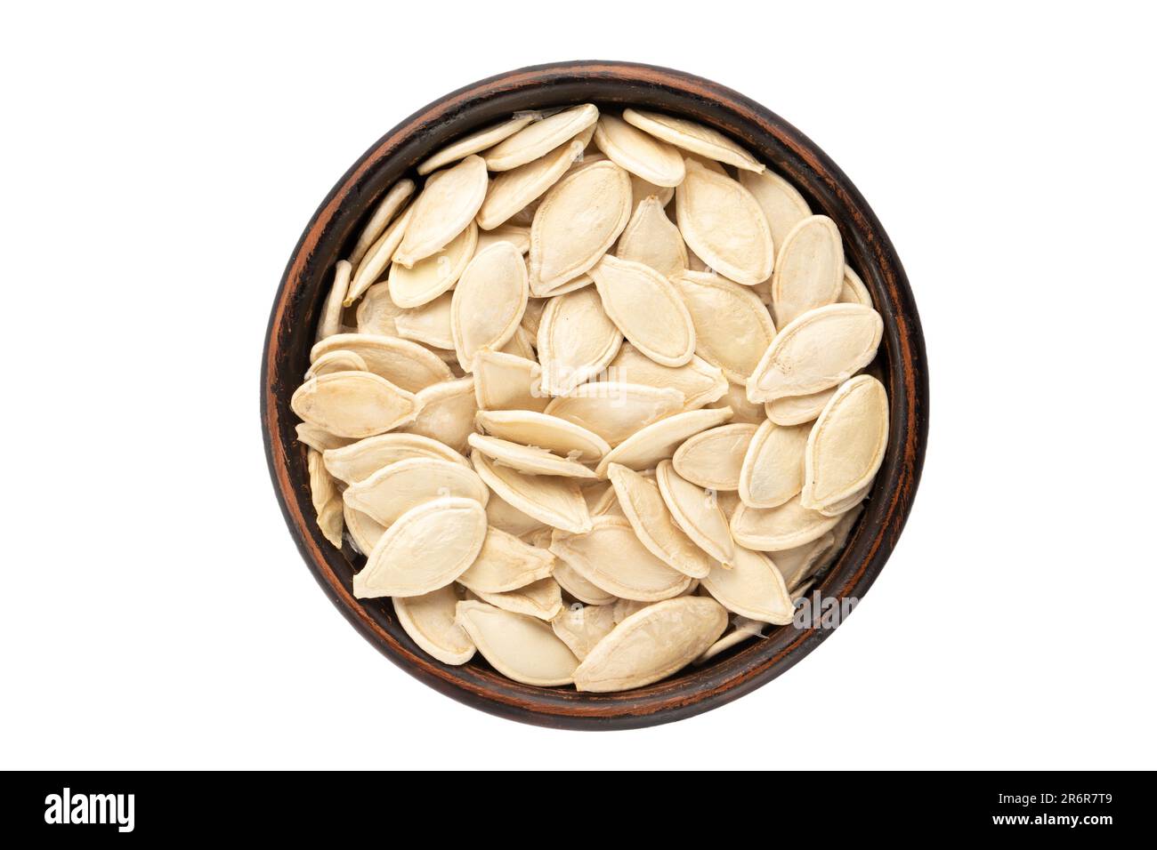 White pumpkin seeds in a plate, top view. Isolated on white background ...
