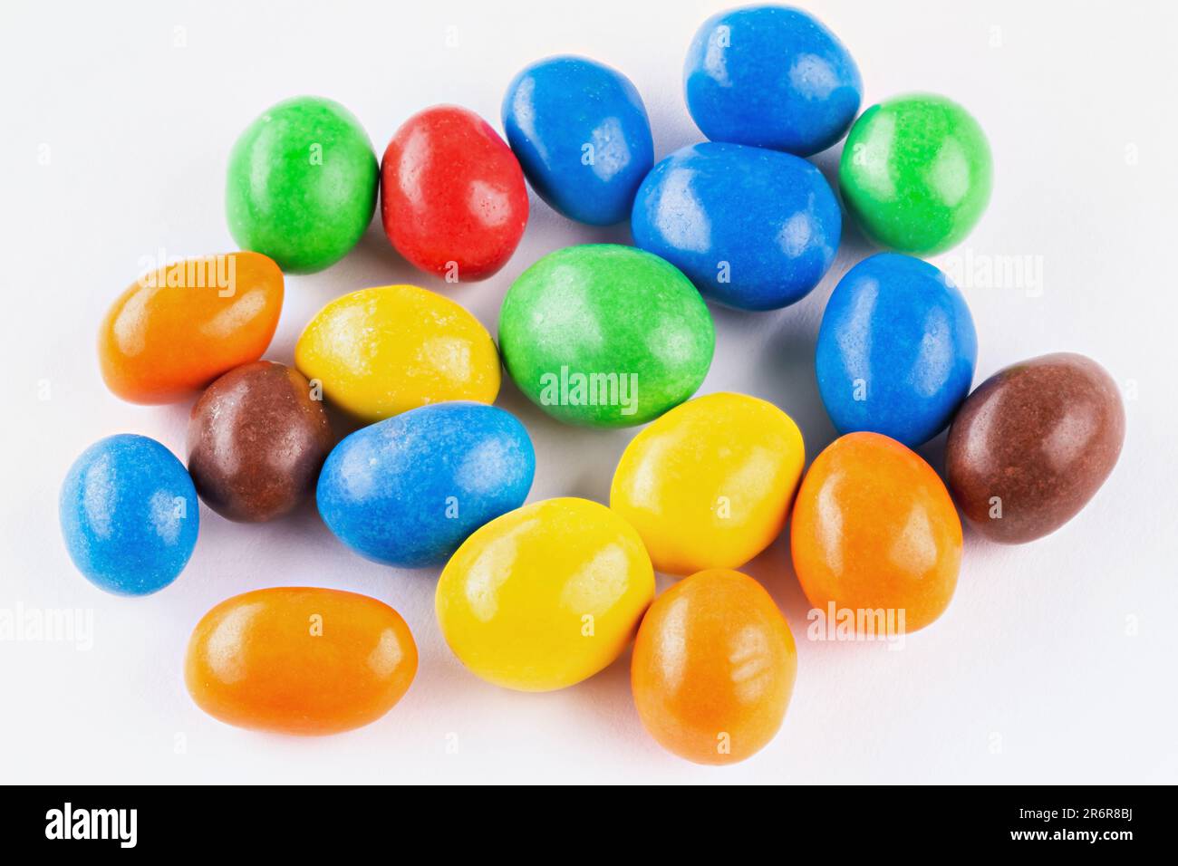 Colorful chocolate buttons, on white background. Chocolate coated ...