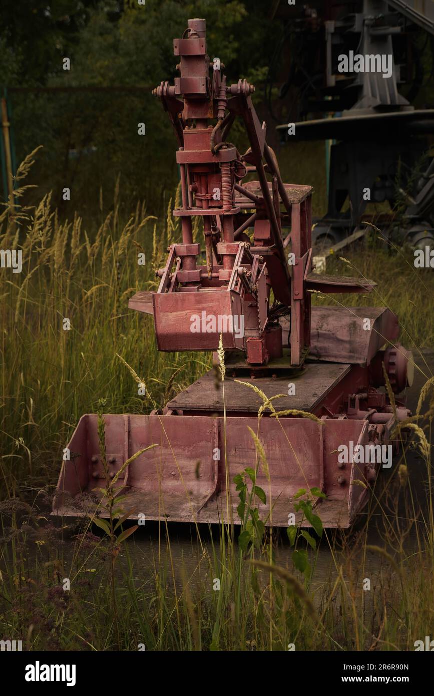 An aged machine cleaning the contaminated area after the catastrophe in ...