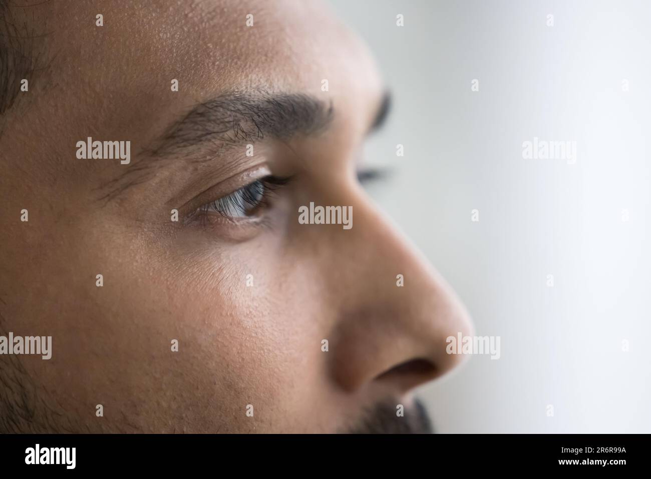 Indian male upper face close up shot Stock Photo - Alamy