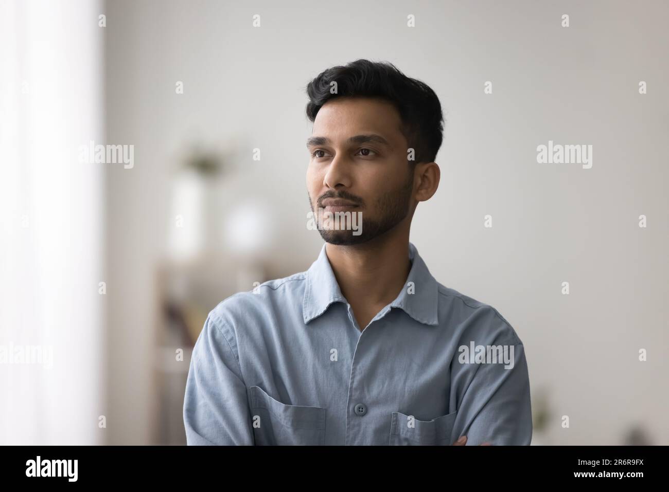 Serious thoughtful young Indian man indoor portrait Stock Photo - Alamy