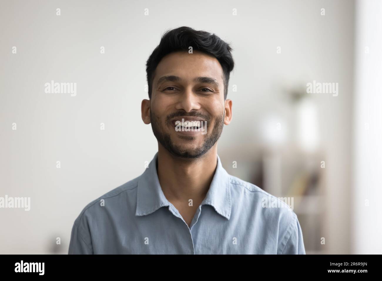 Happy handsome young Indian man head shot front portrait Stock Photo ...