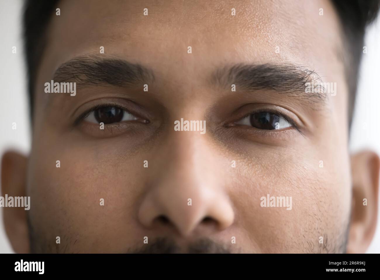 Upper face of handsome young Indian man with black eyebrows Stock Photo ...
