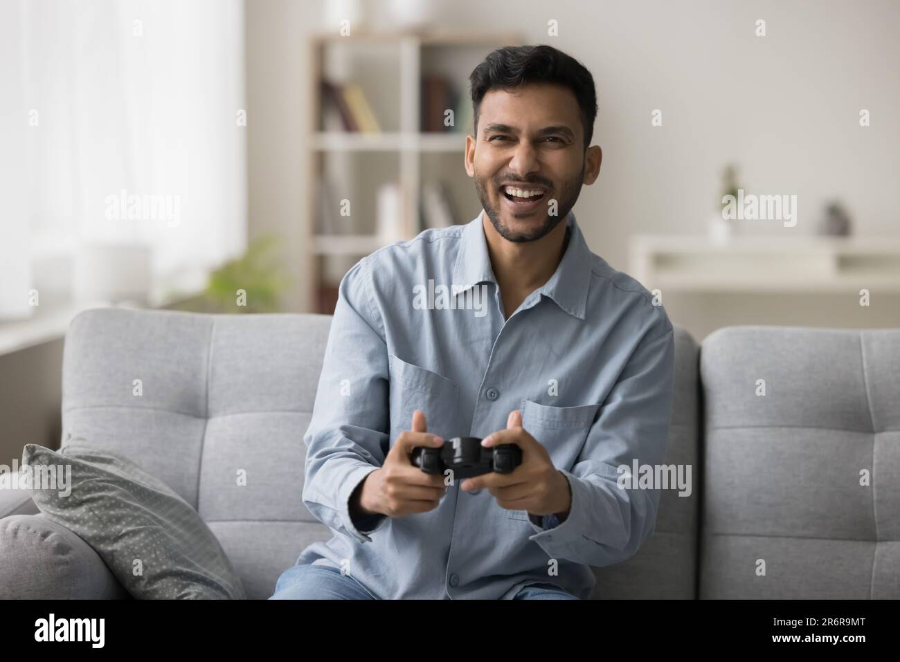 Excited millennial indian guy hi-res stock photography and images - Alamy