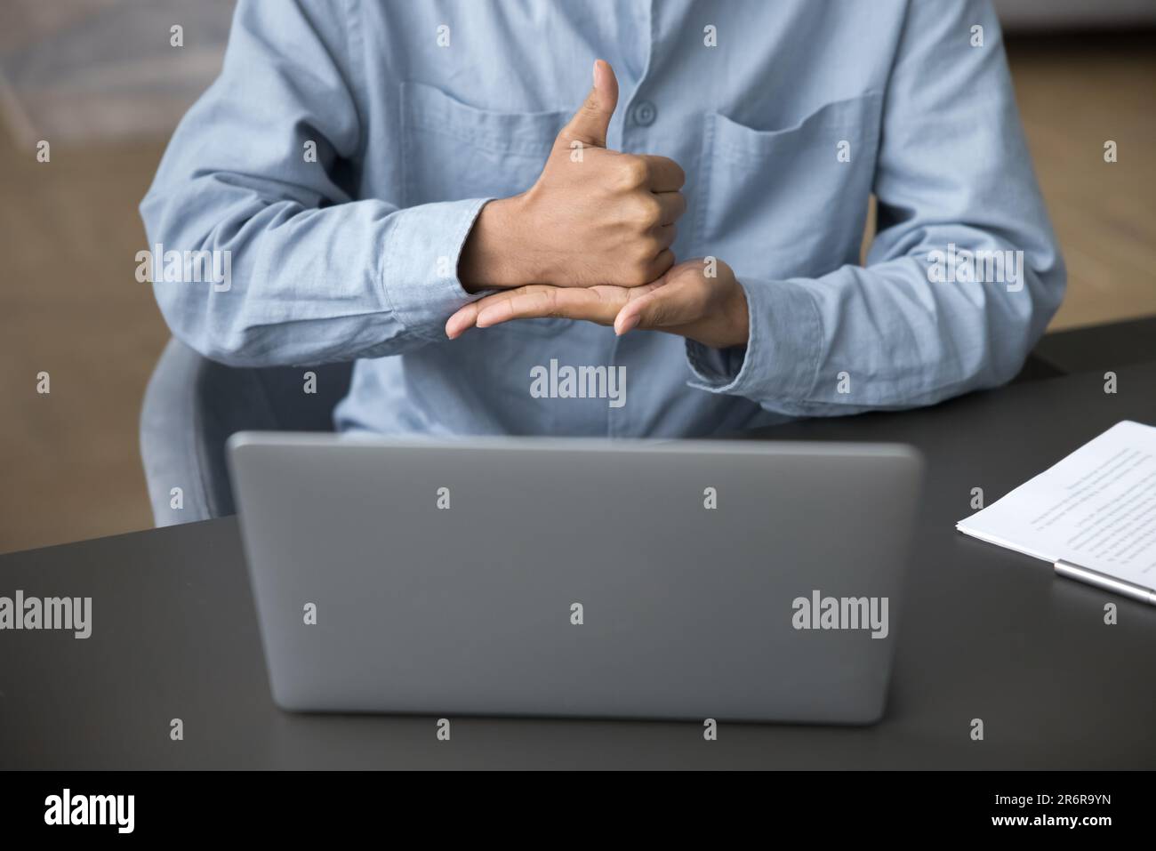 Hands of man with hearing disability talking on video call Stock Photo ...