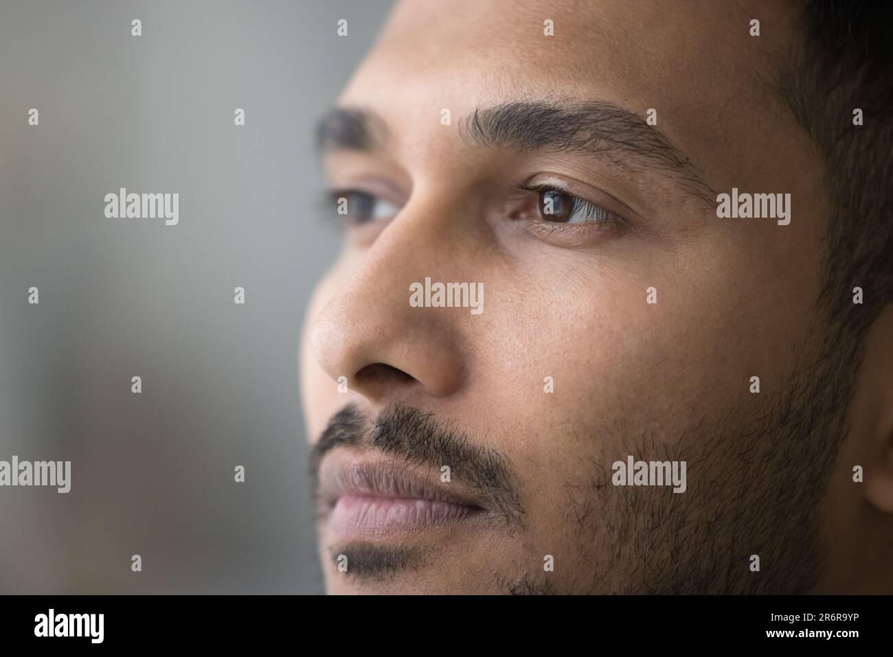 Thoughtful handsome young Indian man facial close up portrait Stock ...