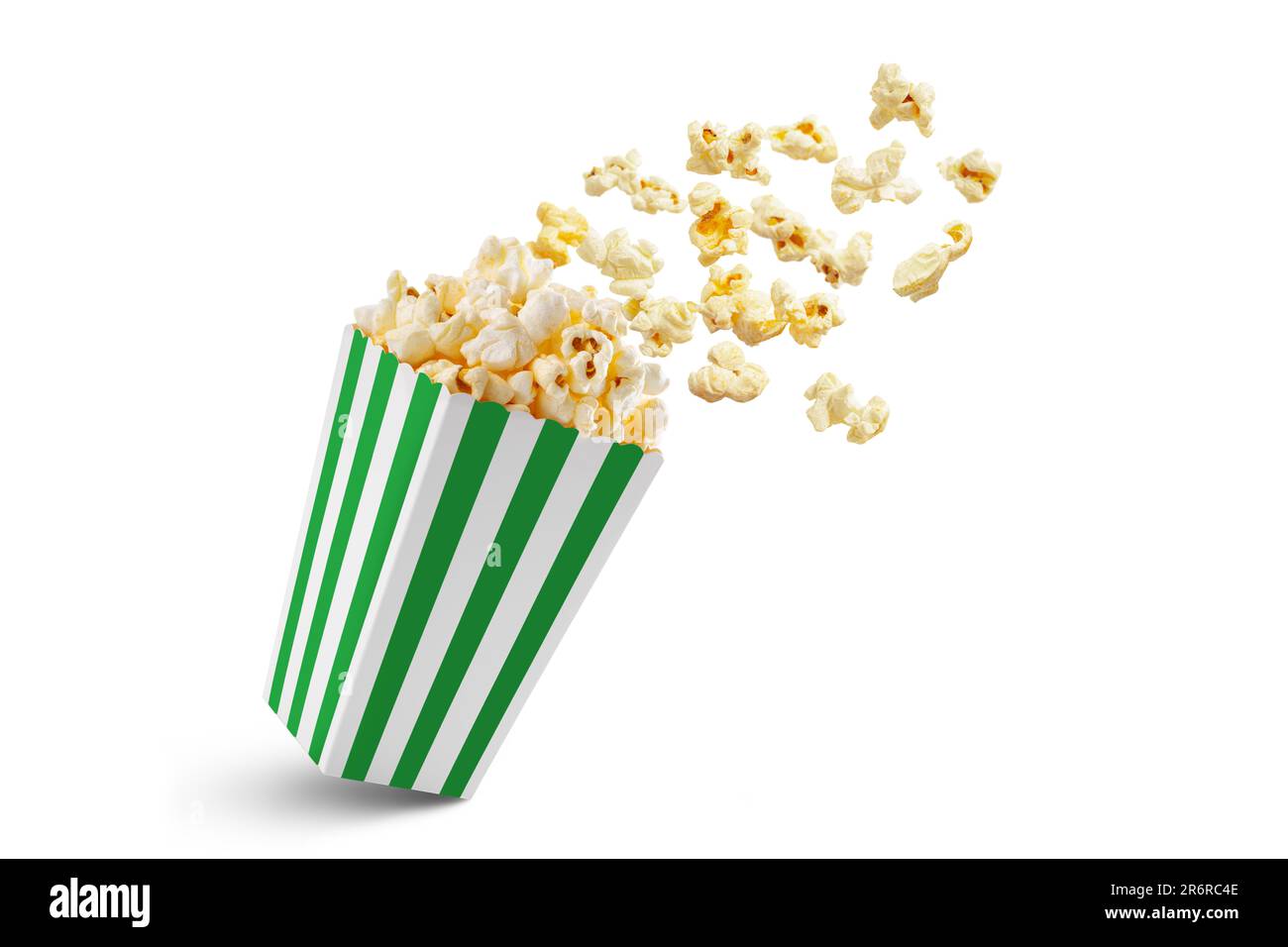 Popcorn flying out of green white striped paper box isolated on white ...