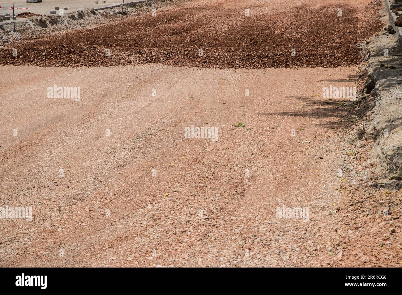 Laying gravel layers during road construction Stock Photo - Alamy