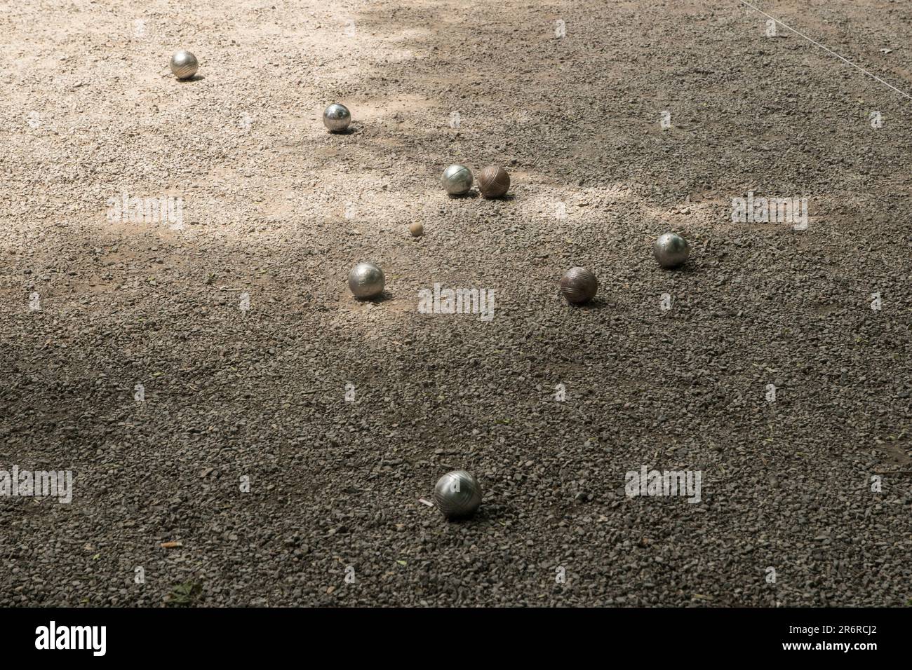 Petanque balls (boules) close to jack target ball on gravel petanque ...