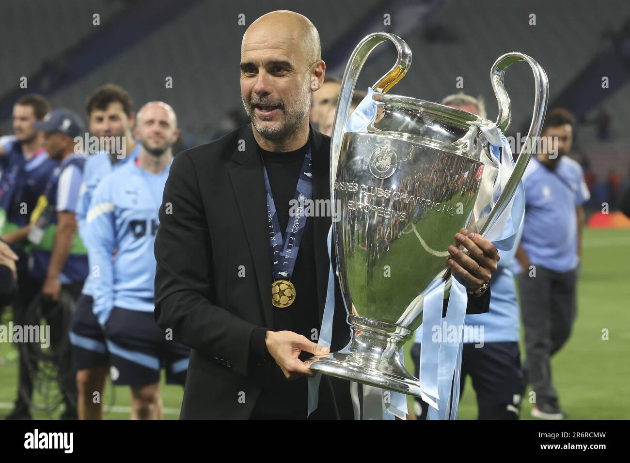 Coach of Manchester City Pep Guardiola celebrates with the trophy ...