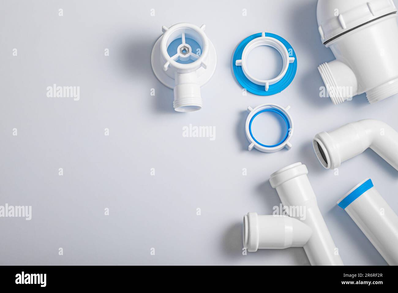 Plastic Sewer Pipes And Accessories On White Background Stock Photo - Alamy