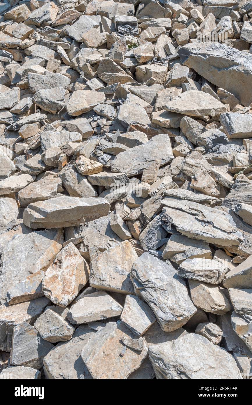 Field of broken hardcore stone in bright sunlight. Being used to patch ...