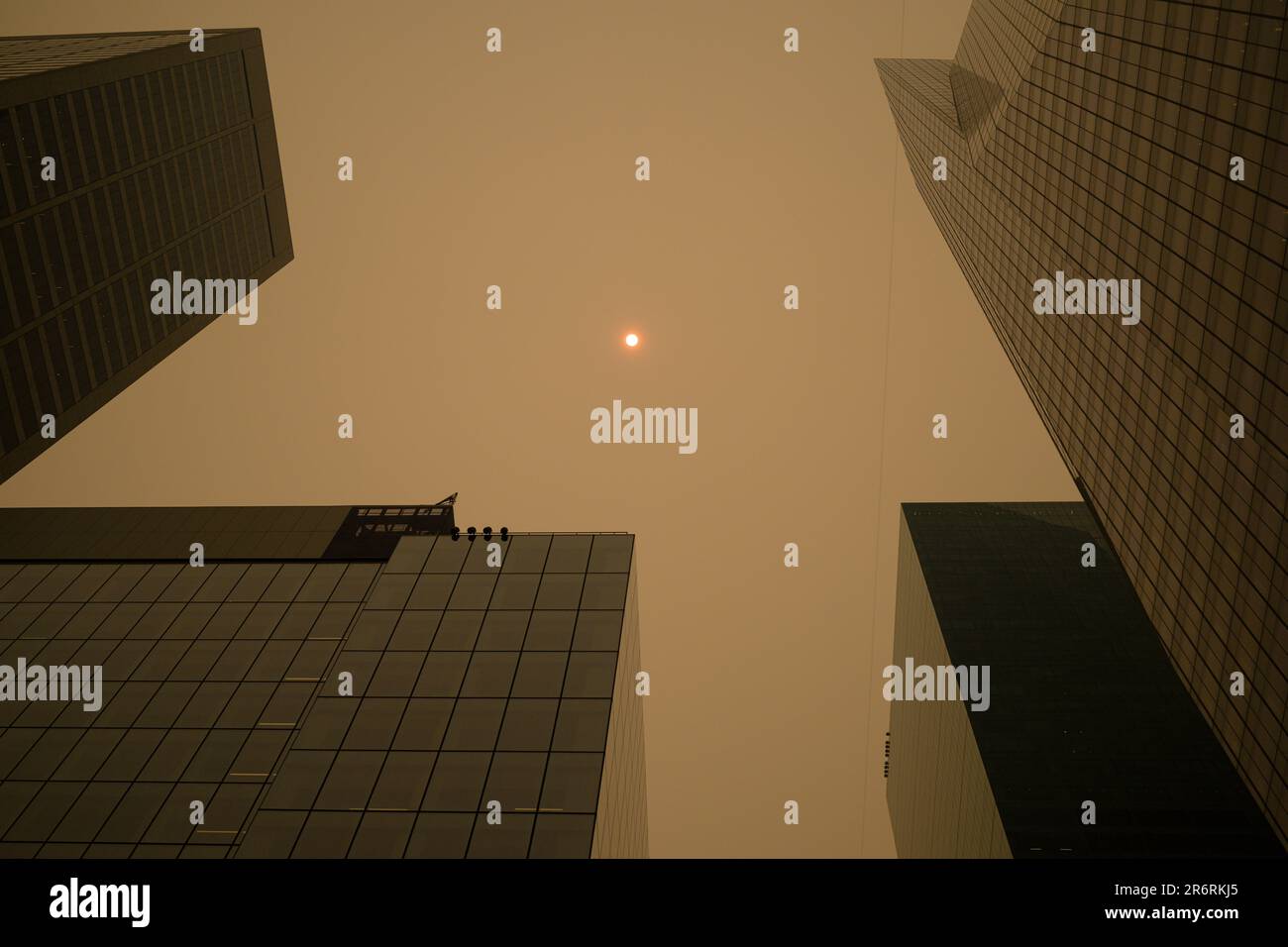 View of the sun between buildings during a period of dangerous air ...