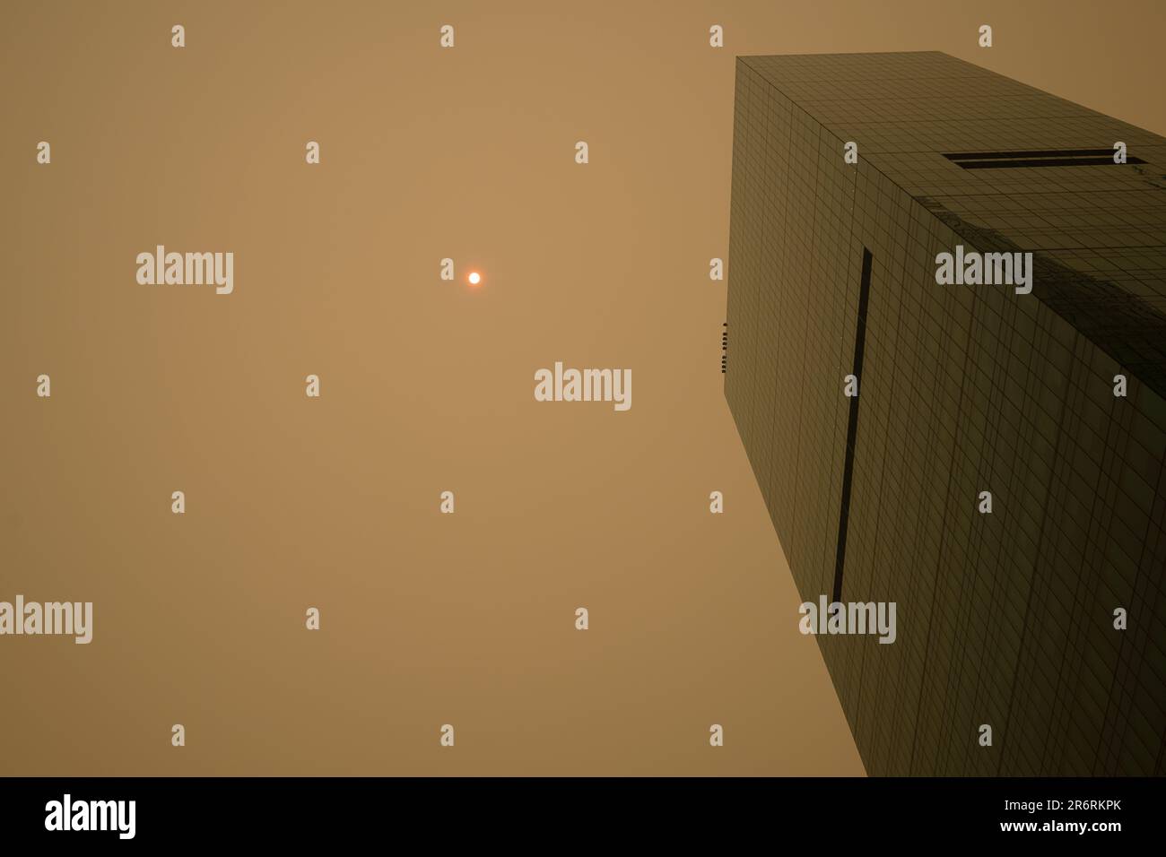 View of the sun between buildings during a period of dangerous air ...