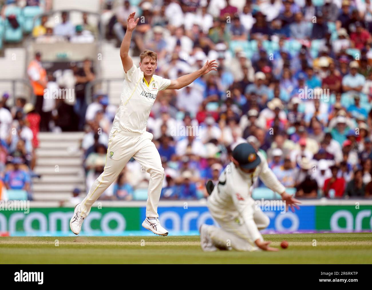 Australia's Cameron Green looks on as team-mate Travis Head fails to ...