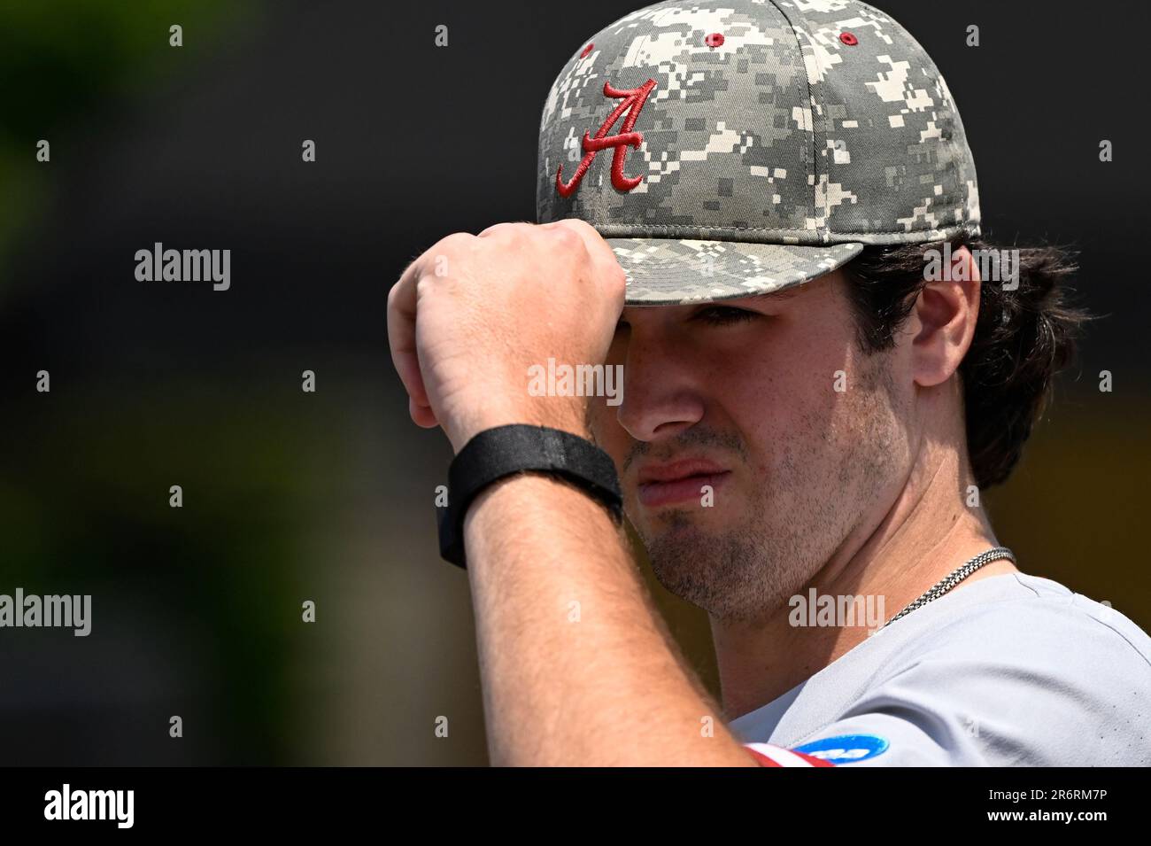 Alabama pitcher Luke Holman adjusts his cap prior to an NCAA college ...
