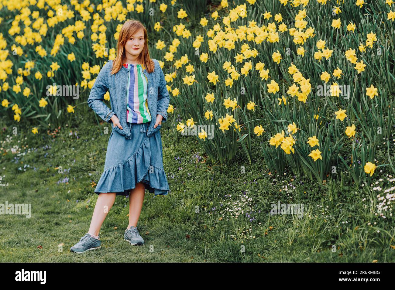 Outdoor spring portrait of young preteen kid girl wearing denim jacket ...