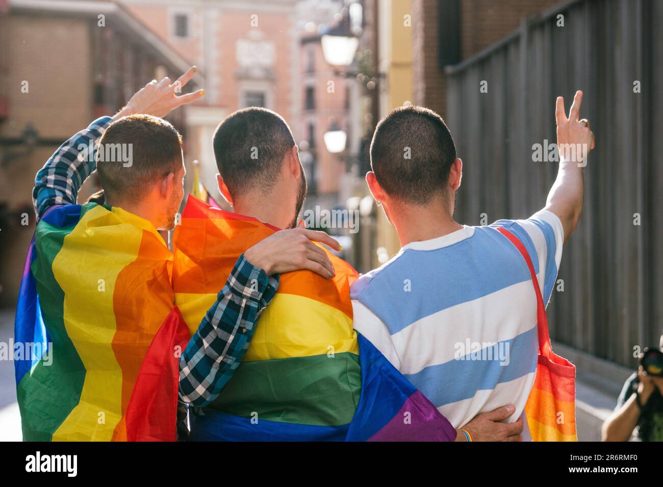 Backlit Sunset: Four Friends Embrace Diversity in Vibrant City Street ...