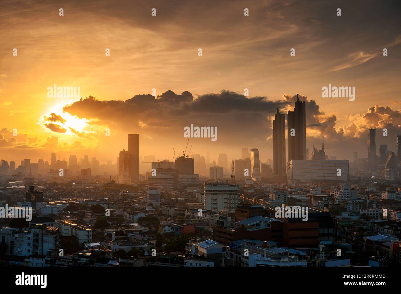 Cityscape of golden sunrise shining on high rise modern office building ...